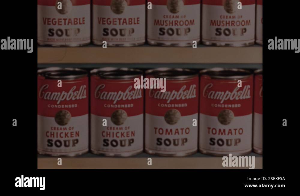 1950s: Cans of Campbell's soup. Man and woman talking in front of soup ...