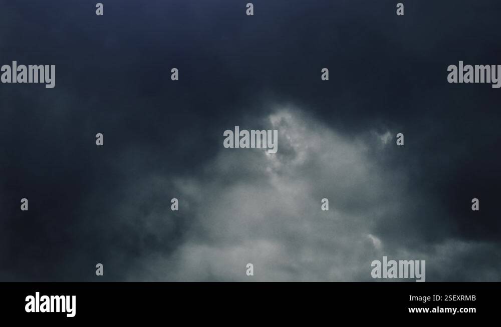 thunderstorm, a ray of light inside a dark gray cloud in the sky that ...