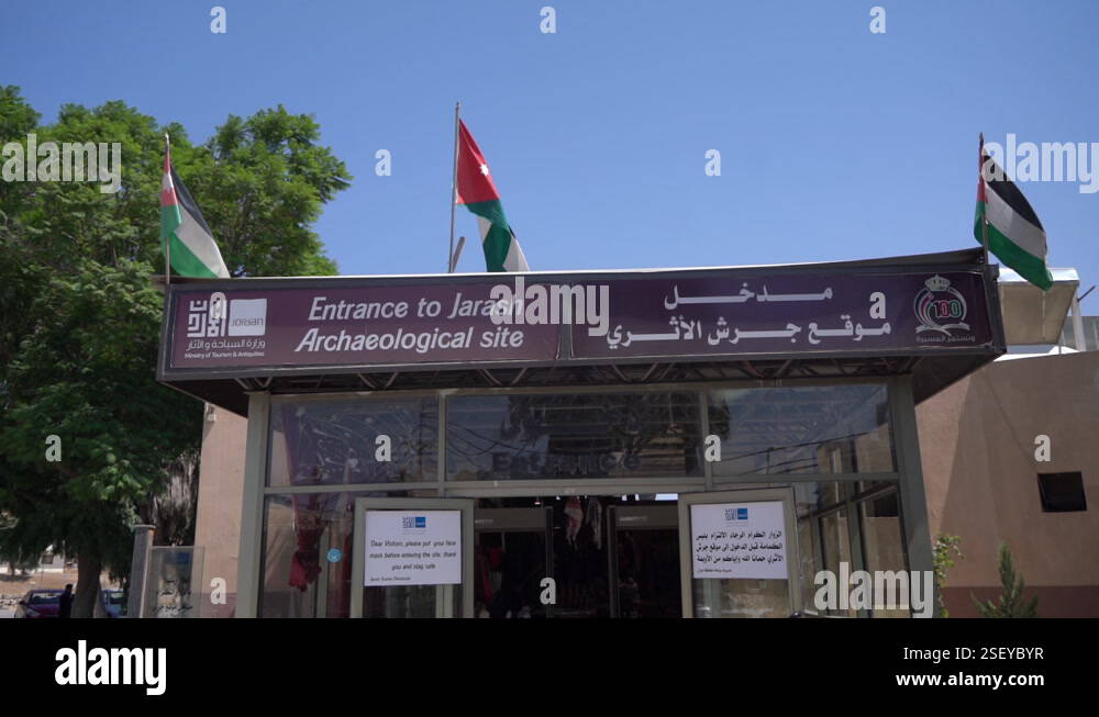Entrance of Jerash Archaeological Site With National Flags of Jordan ...