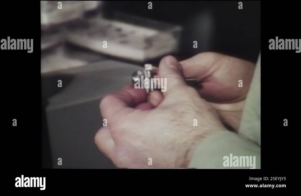 1970s: FBI agent at work in lab, uses equipment, makes image of ...