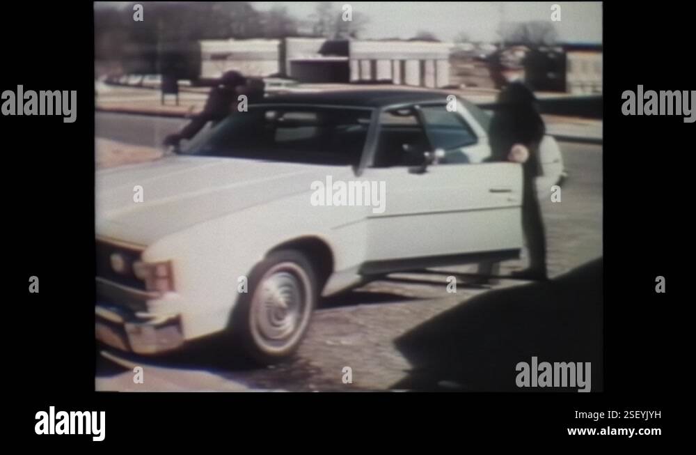 1970s: FBI agent receives diploma from academy in ceremony. Two FBI ...