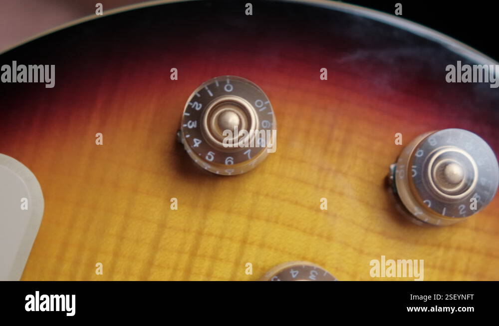 Volume and tone controls of classic wooden-like electric guitar Stock ...