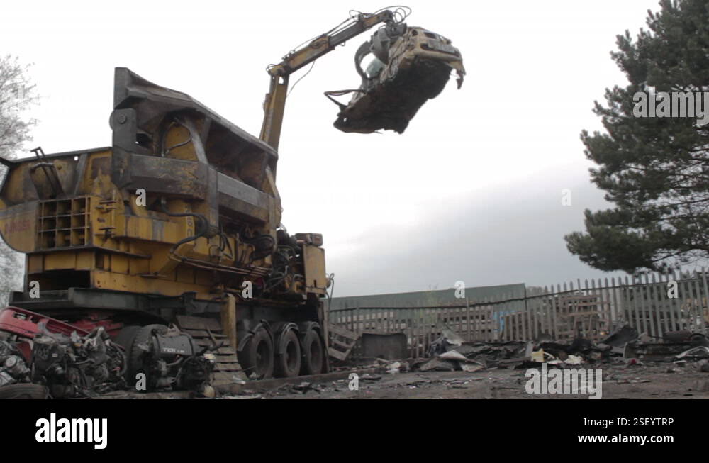 Mechanical Claw Arm dropping crushed car Scrap Metal In breakers yard ...
