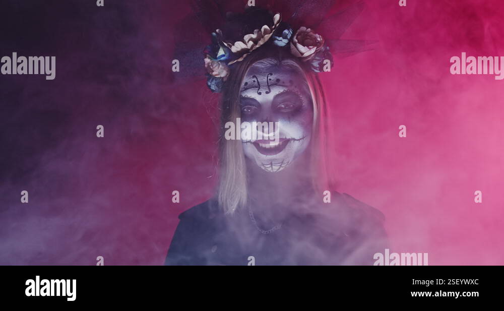 Evil spirit girl eerily smiles at the camera in the woods at night ...