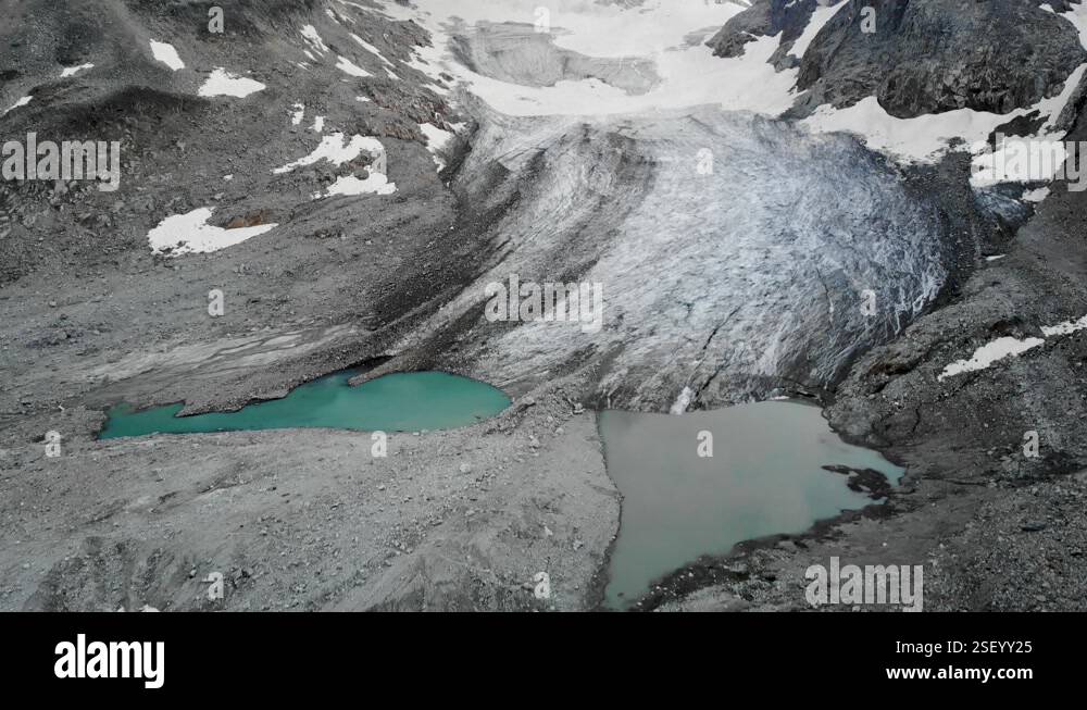 Aerial flyover towards the Witenwasseren glacier with a pan up from its ...