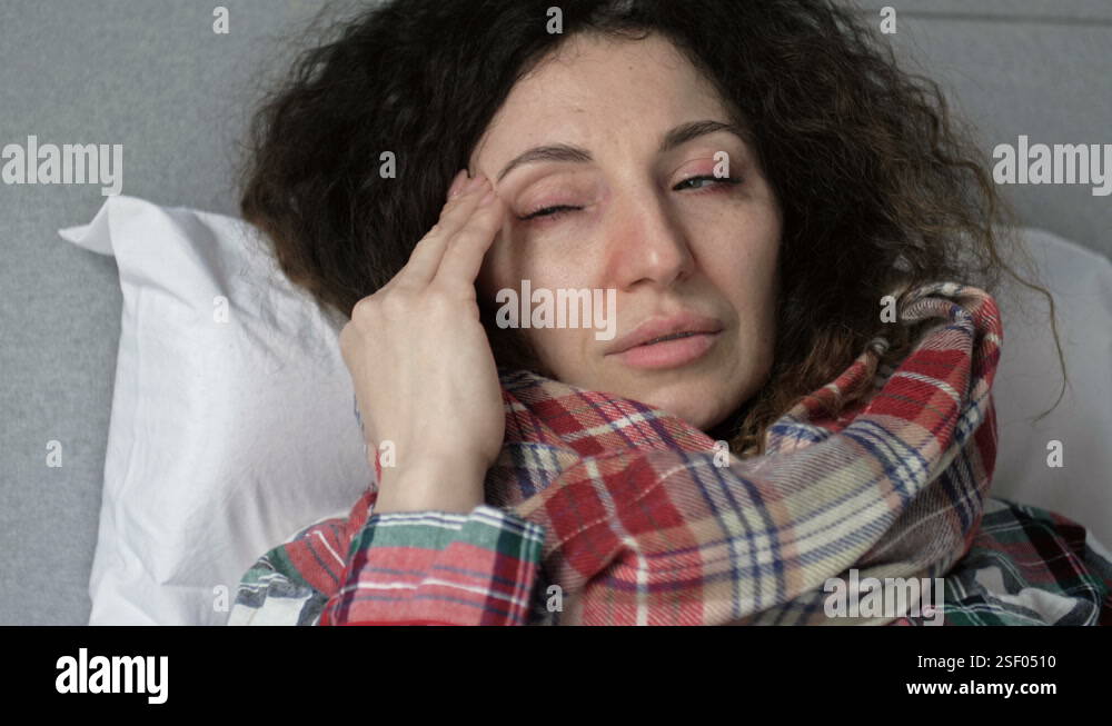 Portrait of a sick woman suffering from headache . Migraine, hangover ...