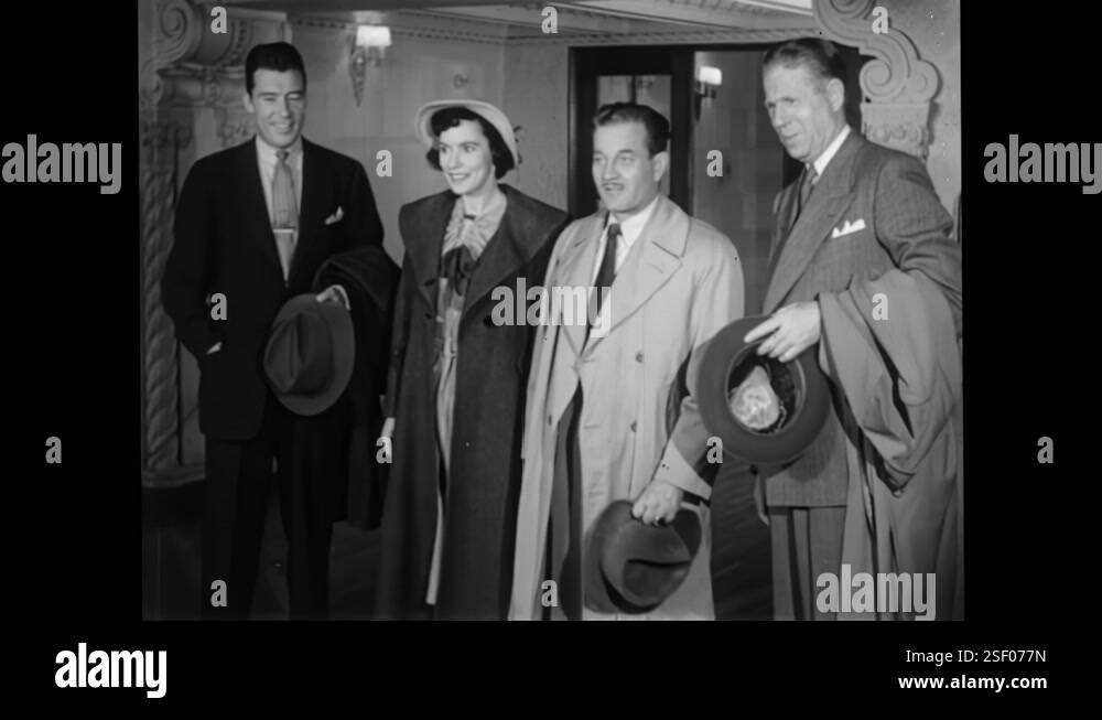 1950s: People on floor in dance hall walk up to stage. Woman and three ...