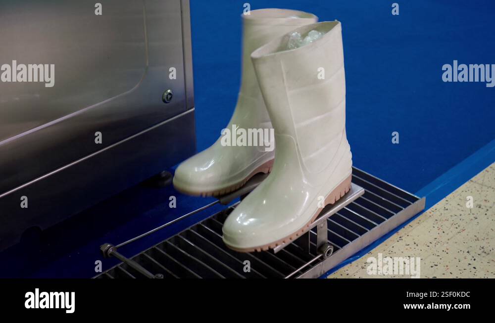 White rubber boots driven on the spot by a motorized mechanical device ...