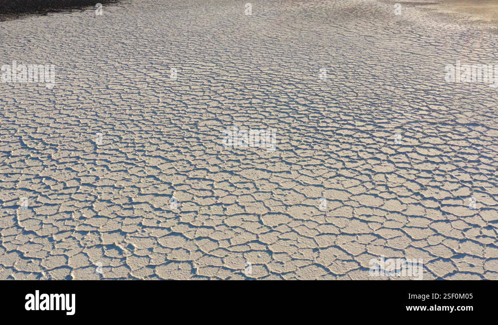 Dry salt flats at Badwater basin of Death valley national park during ...