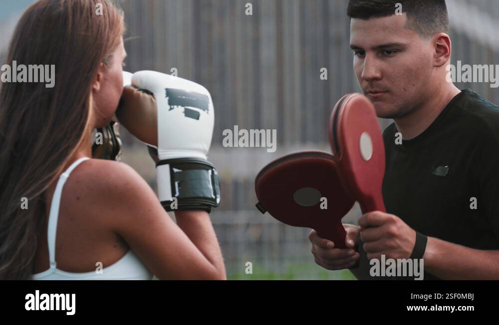 Boxing training young woman punching Stock Videos & Footage - HD and 4K Video Clips - Alamy