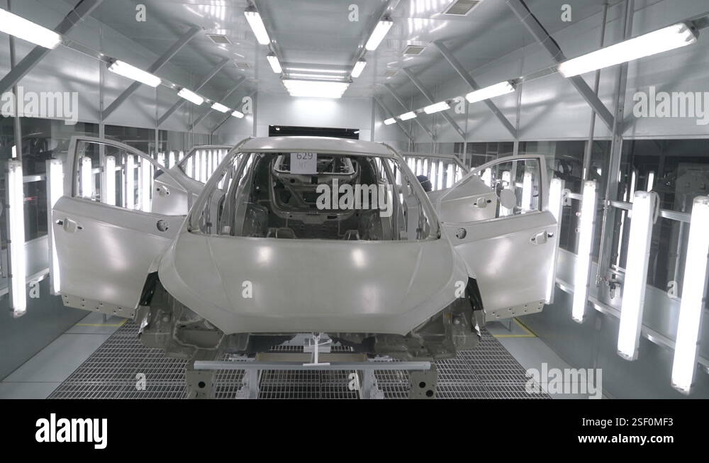 Checkman are checking assembling of cars before painting process. Car ...