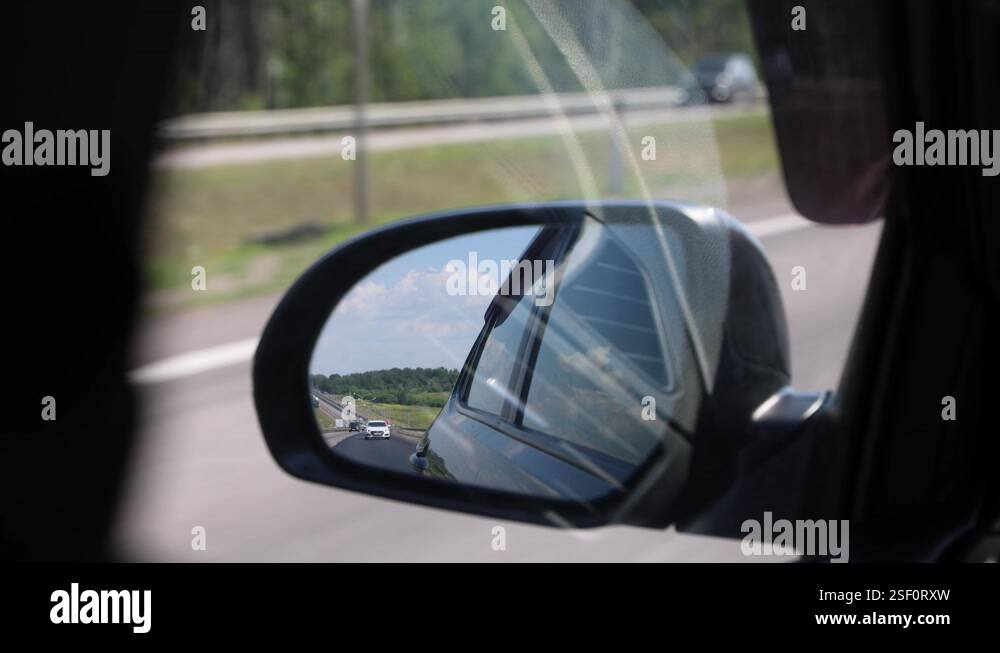 Rearview In The Side Mirror Of The Car, Overtaking Another Car. View ...
