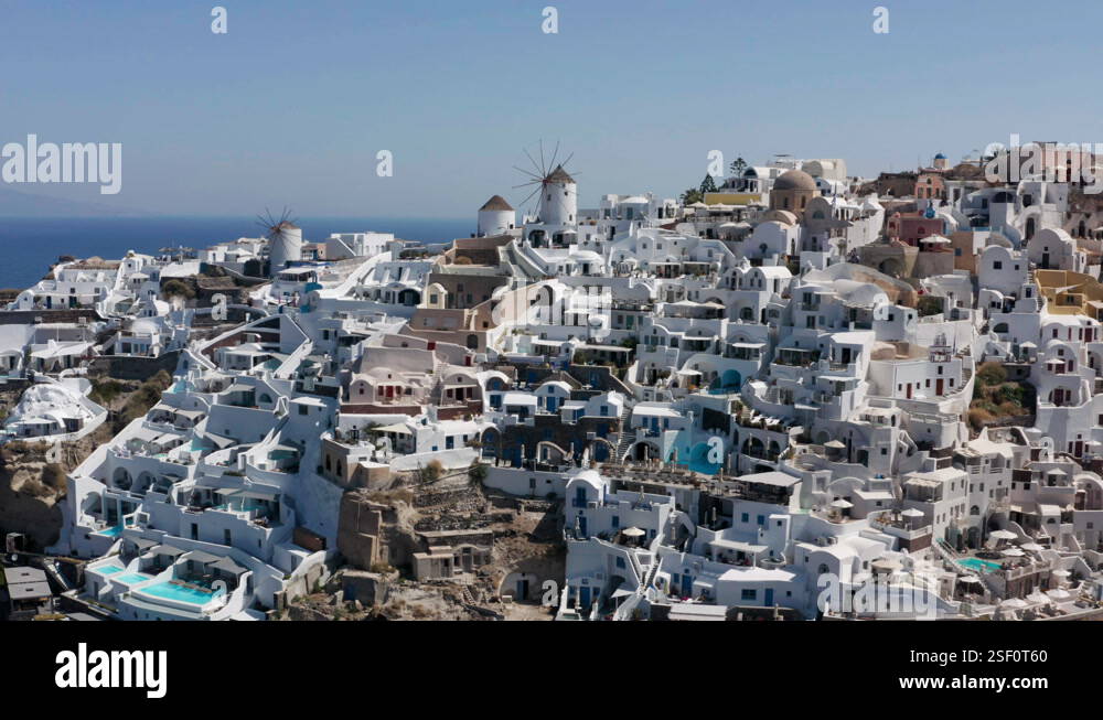 Rugged Clifftops Of Whitewashed Houses In The Famous Town Of Oia In ...