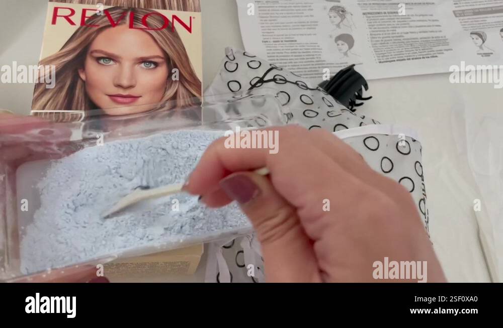 Revlon hair DIY highlighting kit. Hand mixing the highlighting powder ...