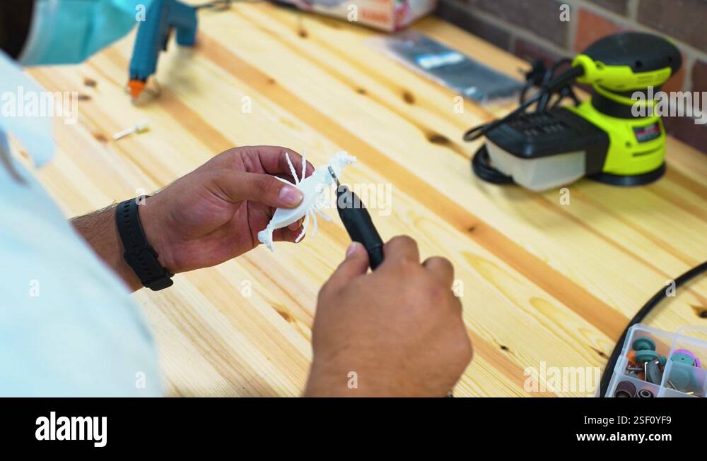 inside fab-lab sanding white 3d printed object Stock Video Footage - Alamy