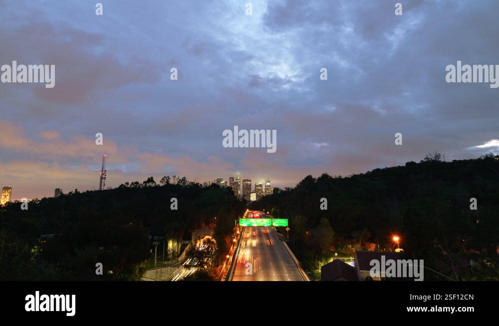 8K Time lapse day to night transition of 110 freeway toward downtown ...
