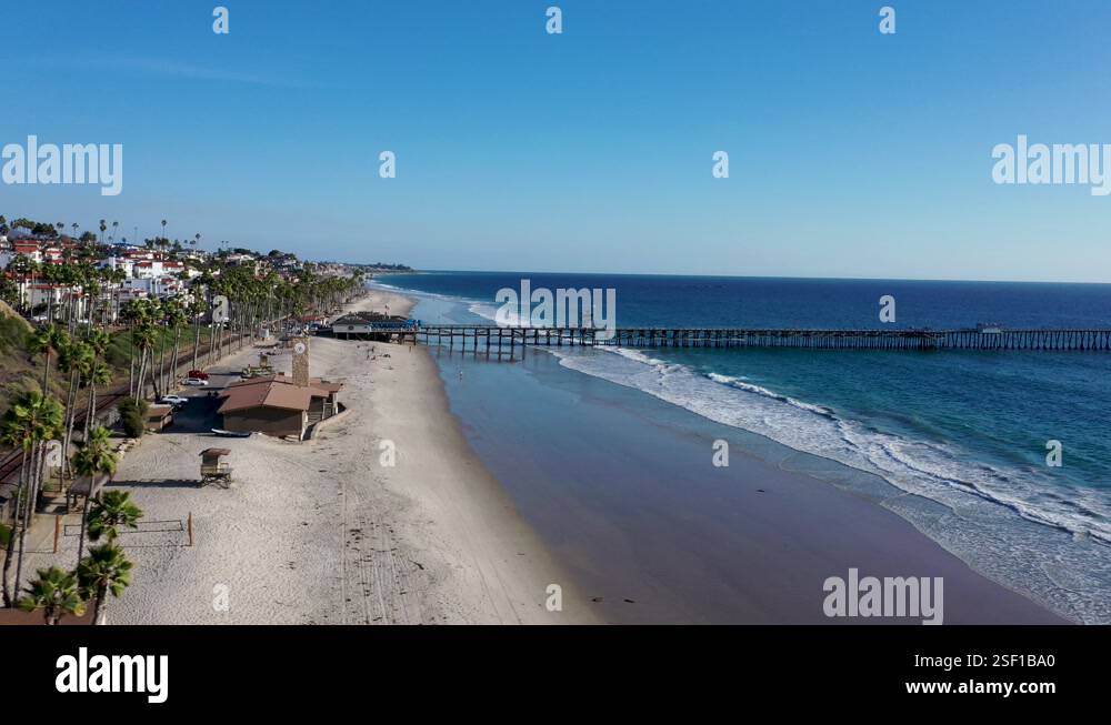 San Clemente beach pier in the summer with blue oceans and blue skies ...
