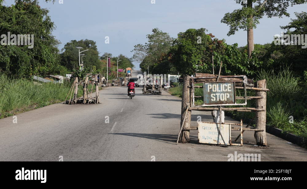 Sierra Leone Africa police road stop checkpoint car motorcycle 4K Stock ...