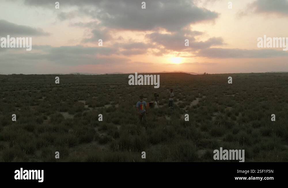 Male Walking Towards Camera In Desert Shrub Landscape Of Balochistan ...