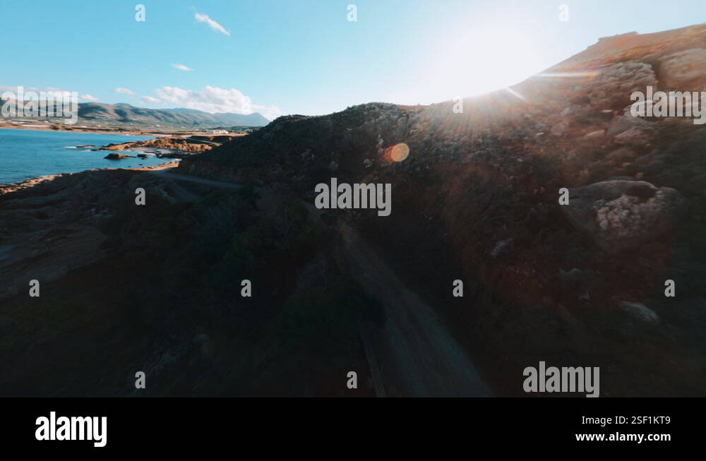 FPV drone shot following a off-road vehicle driving in rocky nature of ...