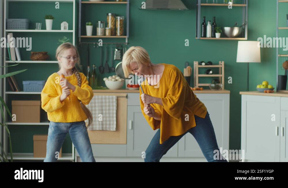 Cheerful Mom and Teenage Girl Jumping, Fooling Around, Having Fun ...