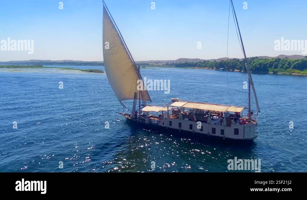 Scenic 4K footage of a sailing boat navigating peacefully in the waters ...