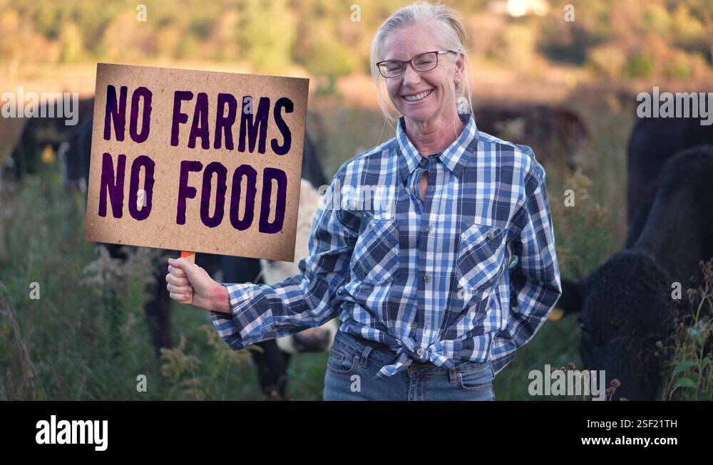Smiling, pretty woman holding sign that says No Farms No Food ...