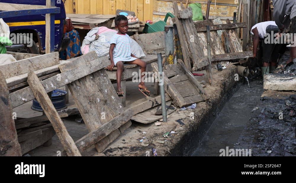 Girl garbage sewer ditch drain poverty area Accra Ghana 4K Stock Video ...