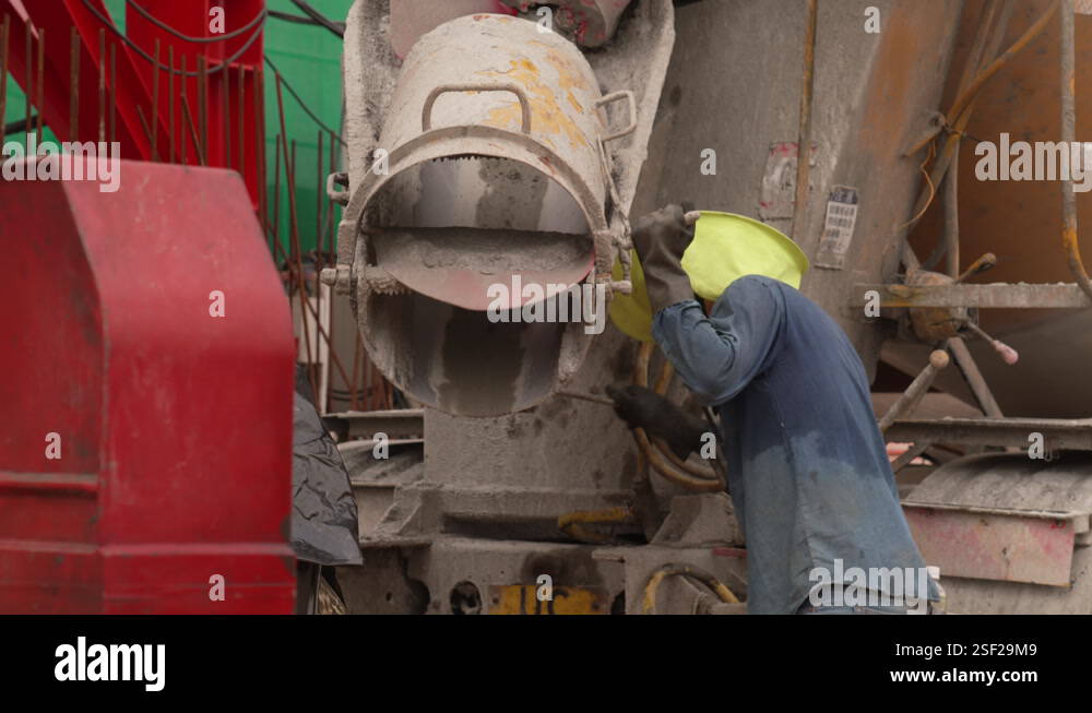 Chuteman Handling Rear Discharge Chute Of A Concrete Mixer Truck ...