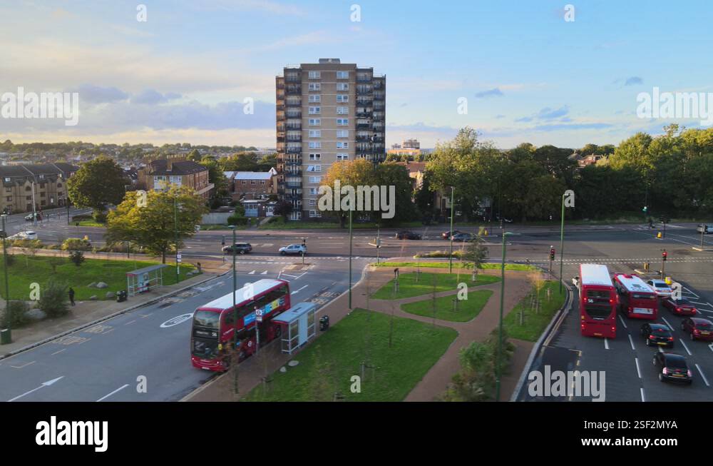 Low traffic on crossroads in town, red double deckers Stock Video ...
