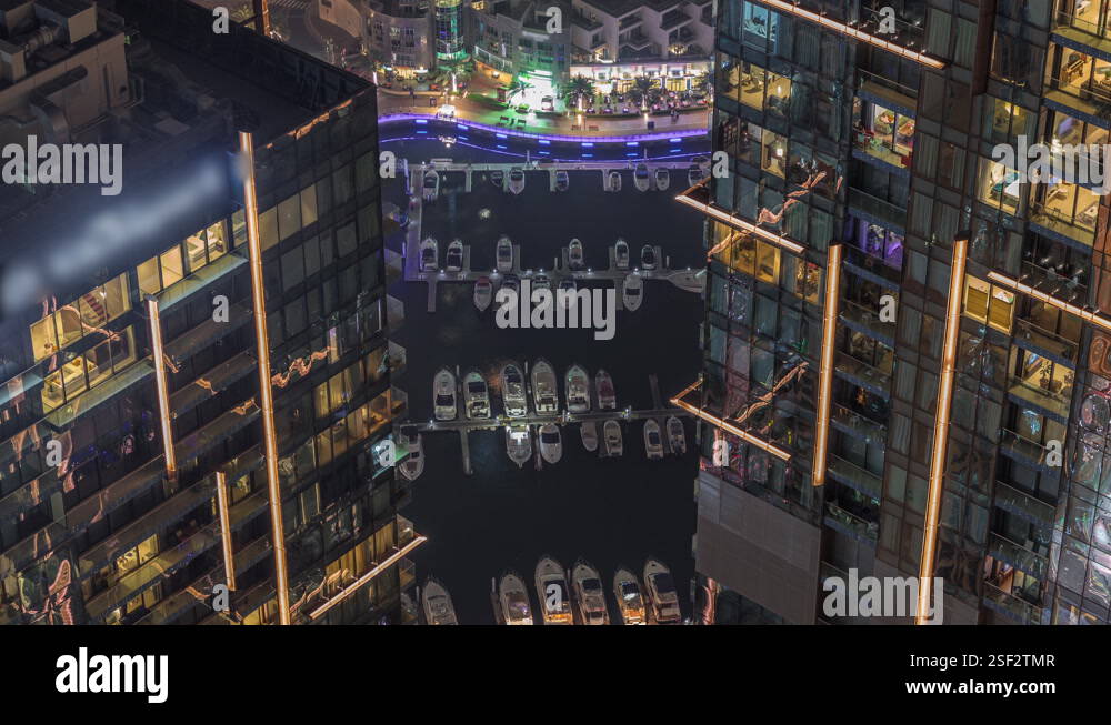 Looking down view perspective on night highlighted luxury Dubai Marina ...