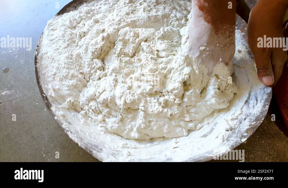 Manually making paste for renovation of walls with putty. Close up ...