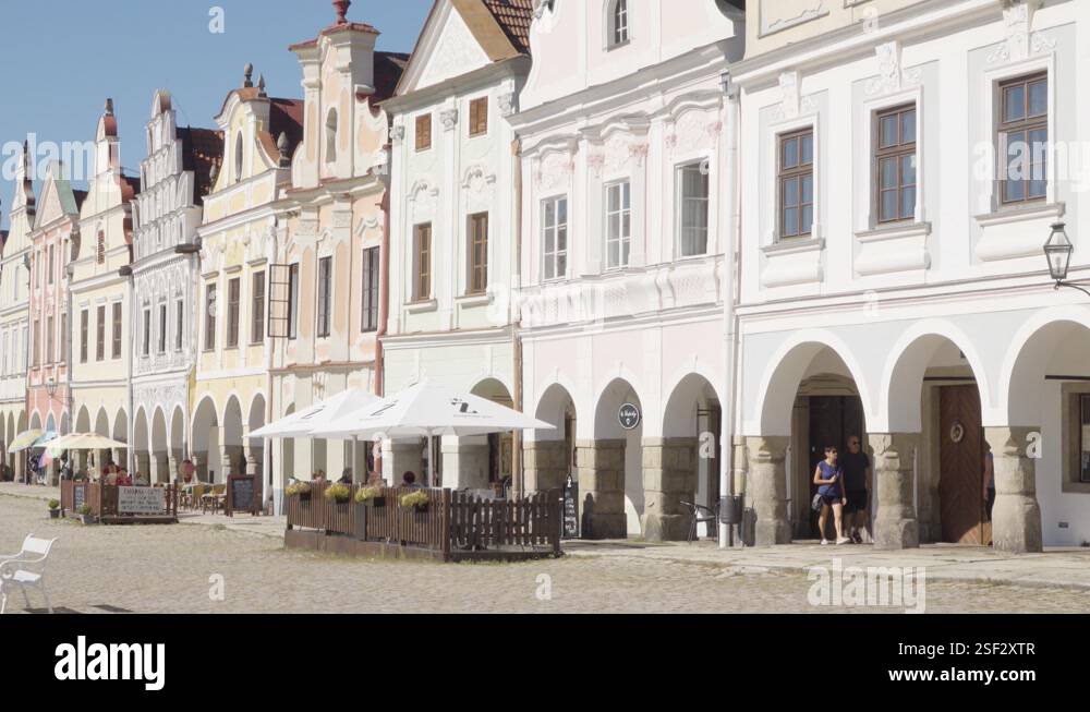 Colorful buildings and restaurants with outdoor seatings in a quaint ...