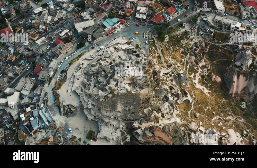 Epic aerial shot around ancient historic settlement inside rock ...