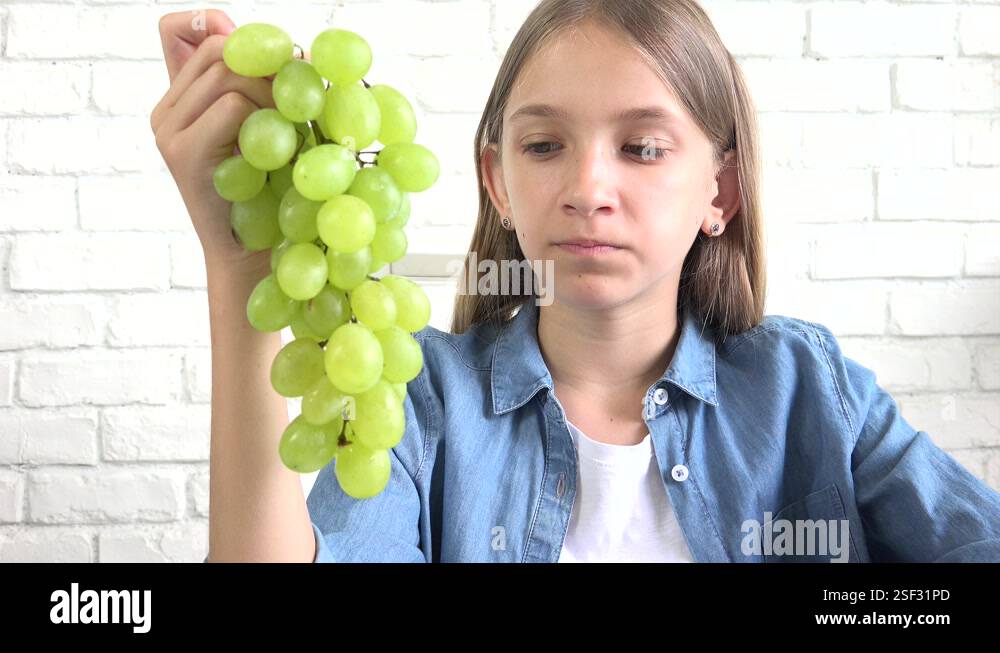 Child Eating Grapes at Breakfast, Kid Eats Fruits in Kitchen, Hungry ...