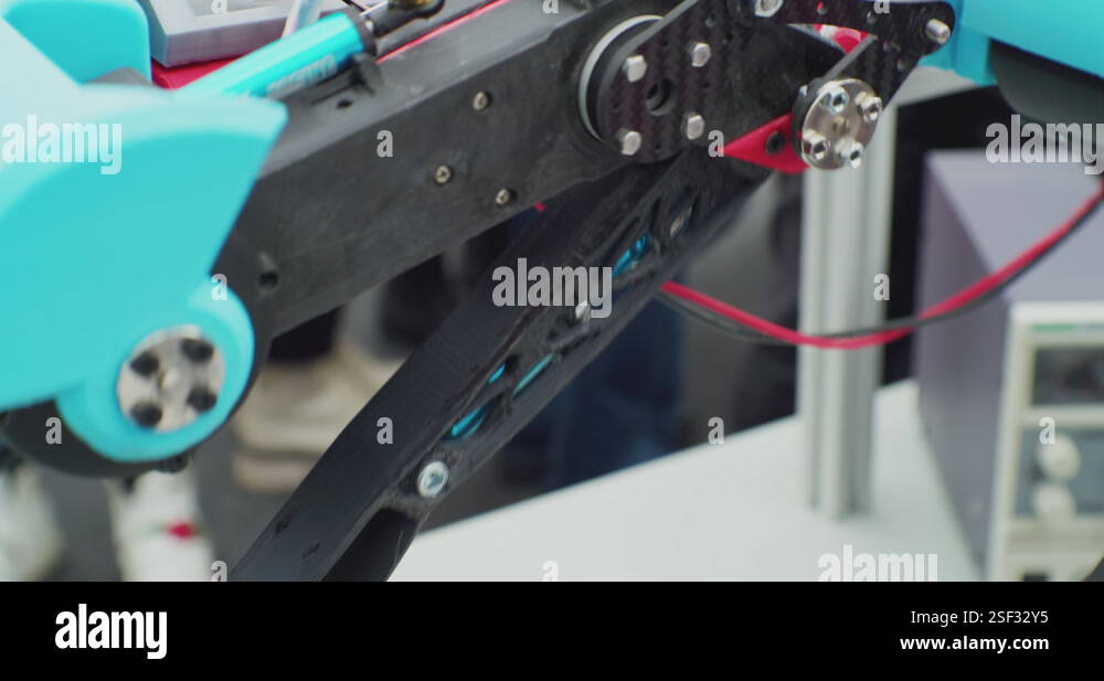 modern technologies. testing of an industrial robot fixed on a stand ...