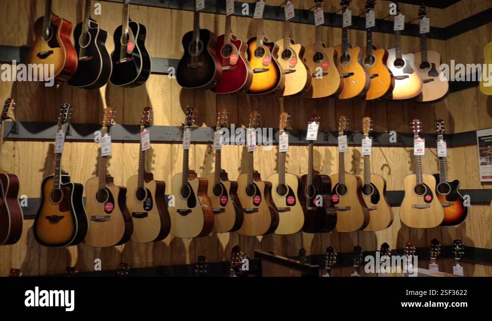 Guitar Center in Augusta slow pan interior wall of acoustic guitars ...