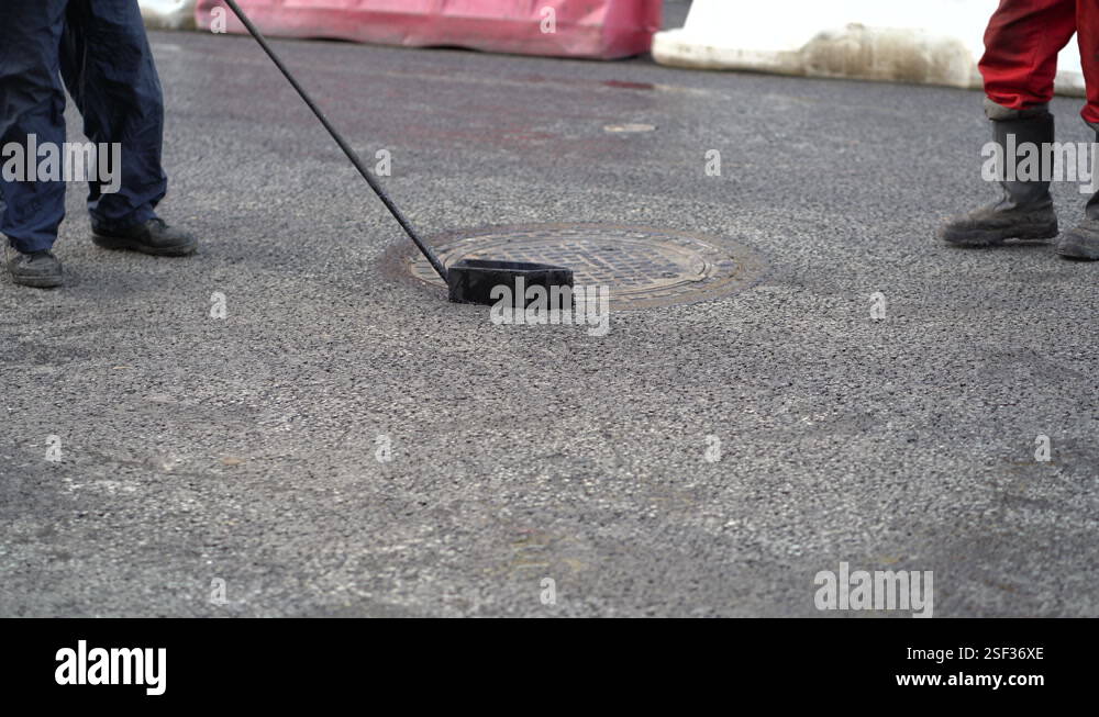Manhole cover paving Stock Videos & Footage - HD and 4K Video Clips - Alamy