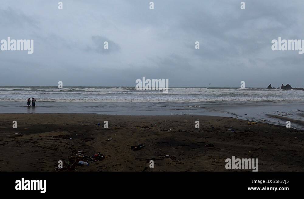 Arambol beach in monsoon, Goa. Water waves crash into rocks and Sea ...