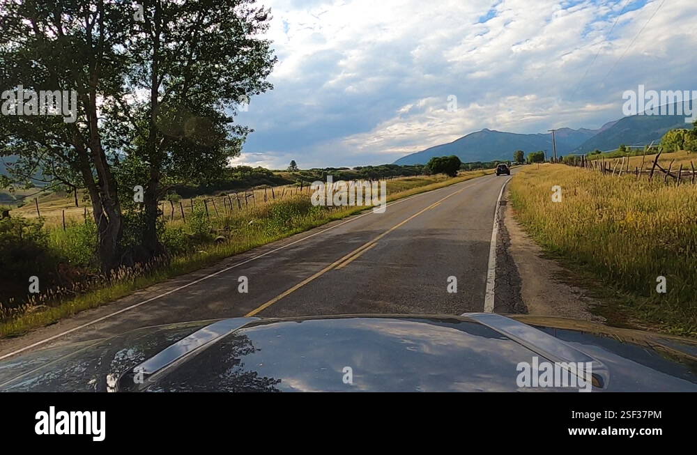 Starting road trip by driving into the country on a paved road near 40 ...