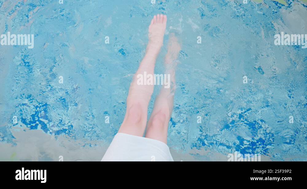 kicking water in the pool Stock Video Footage - Alamy
