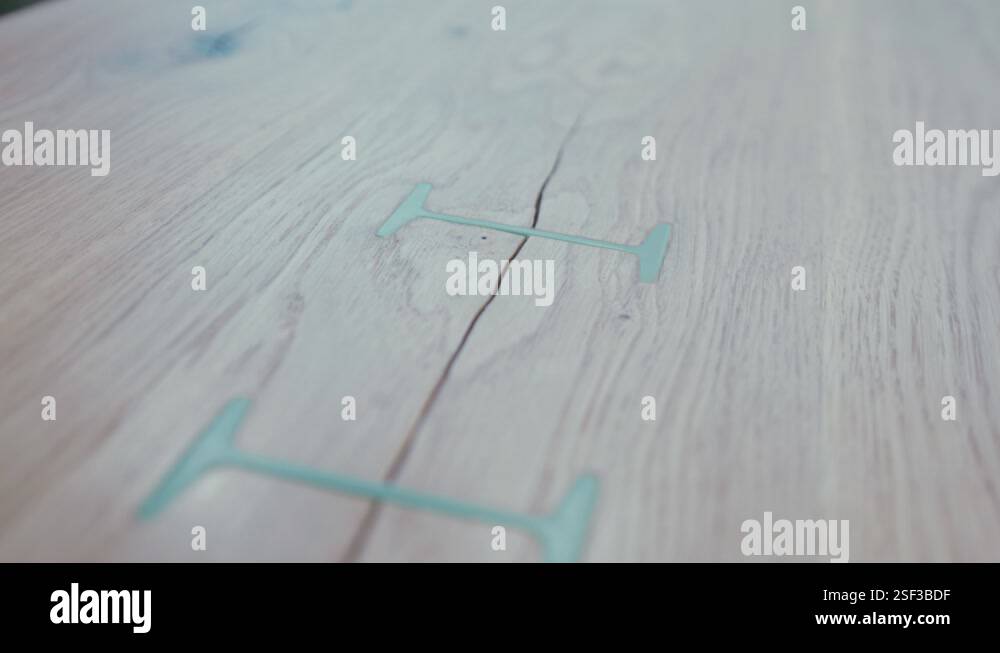 Steel butterfly joints in white oak timber table surface Stock Video ...