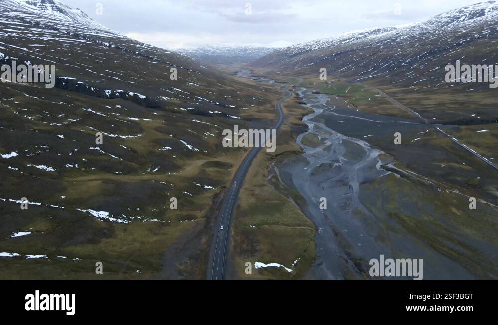 Aerial tilt up view gently over Ring Road with cars driving peacefully ...