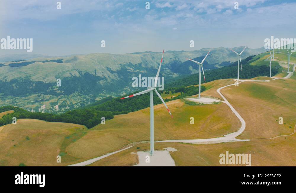 Aerial view of white wind turbines generator in a field in Montenegro ...