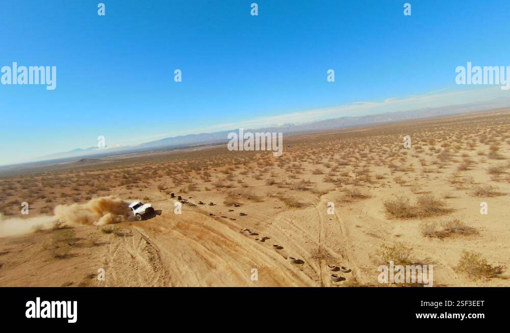 An off-road truck speeding through a Mojave Desert race track near Baja ...