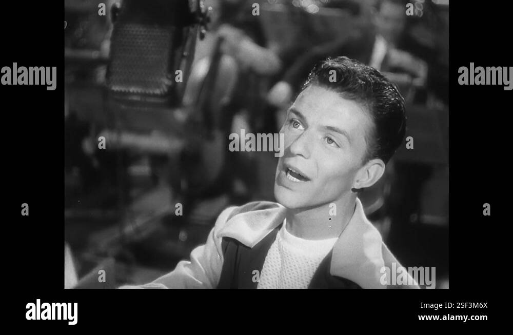 1940s: Frank Sinatra in studio sings song into microphone, as band ...