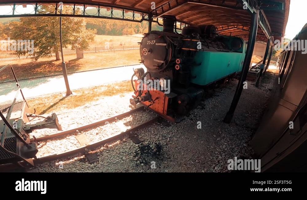 Vintage train passing old locomotives in Mokra Gora, Serbia Stock Video ...
