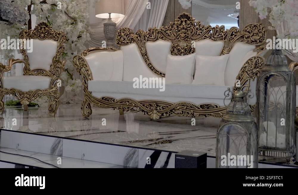 Pan shot of a well furnished furniture store featuring luxurious sofa ...