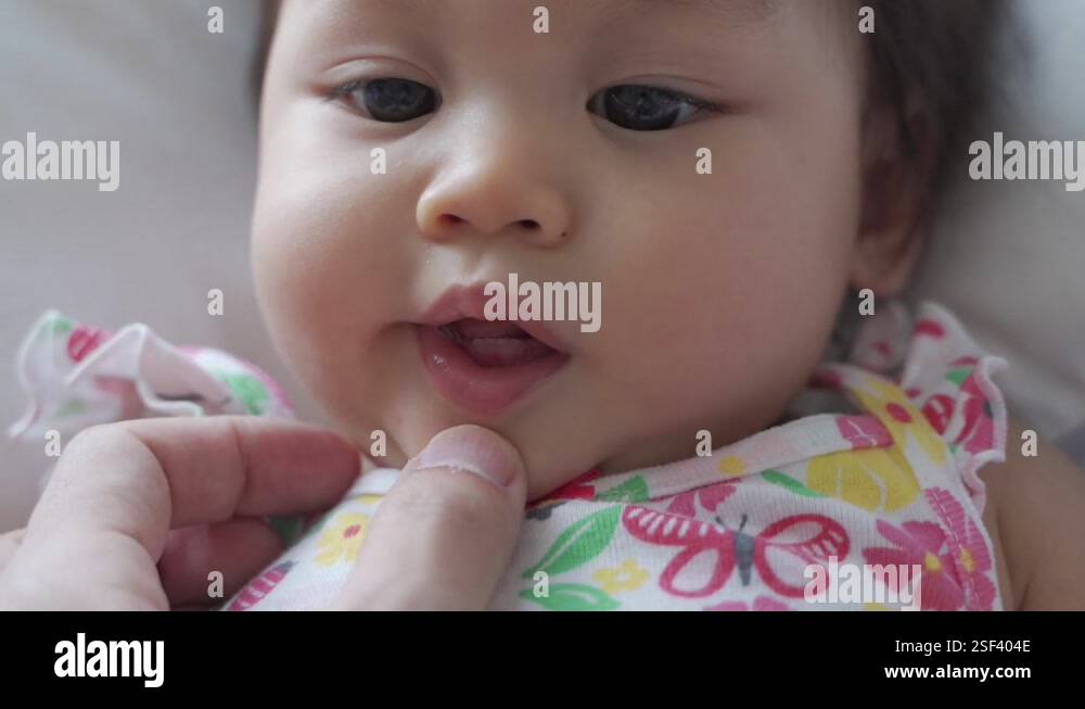 first baby tooth, deciduous tooth, primary tooth of infant kid. happy ...