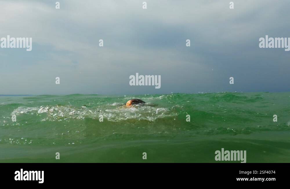 Cute child girl having fun with somersault in sea water with diving ...